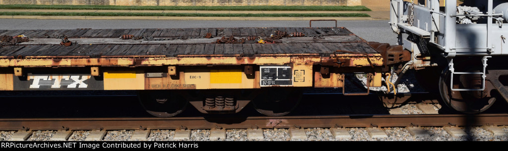 HTTX 92747 01-1967 built F-60CH 60-foot flat car with wood deck and tie-down chains on CSX in ...